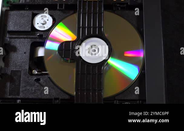 An open DVD player shows its internal components and circuitry, with ...
