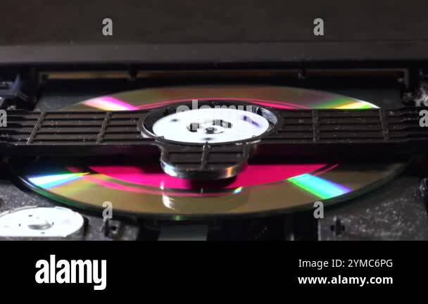 An open DVD player shows its internal components and circuitry, with ...