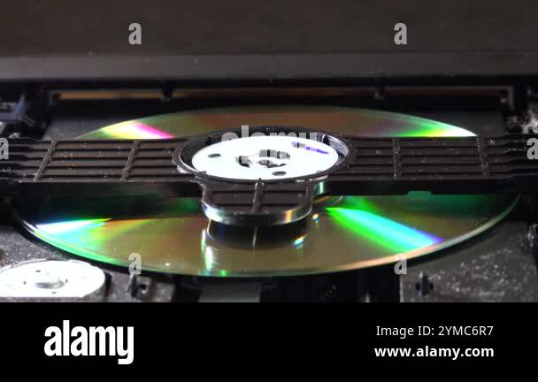 An open DVD player shows its internal components and circuitry, with ...