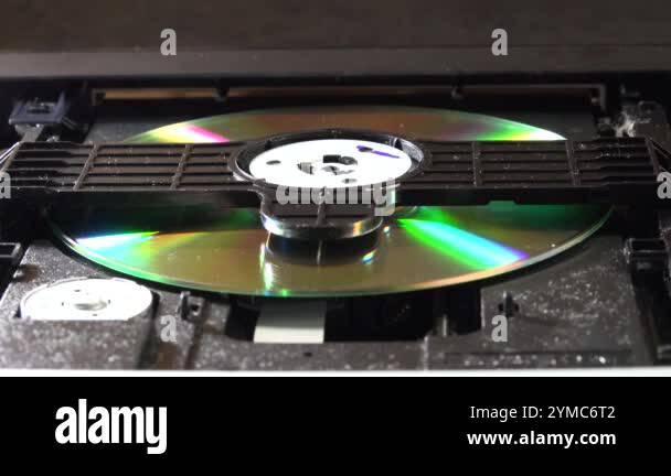 An open DVD player shows its internal components and circuitry, with ...