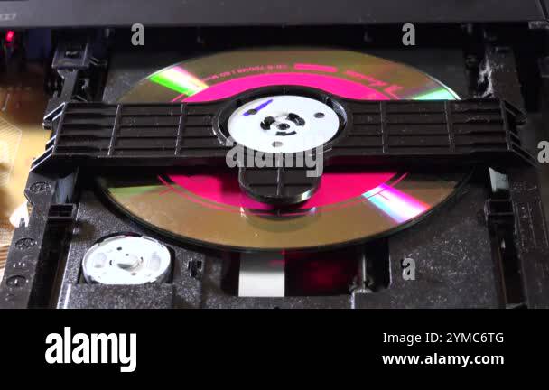 An open DVD player shows its internal components and circuitry, with ...