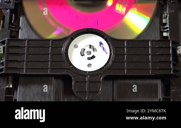 An open DVD player shows its internal components and circuitry, with ...