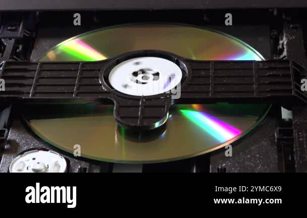 An open DVD player shows its internal components and circuitry, with ...