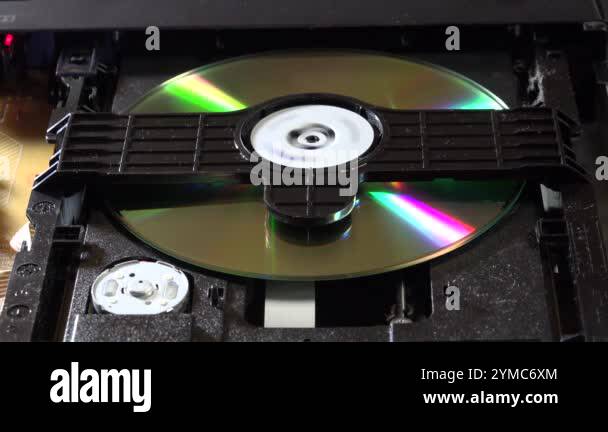 An open DVD player shows its internal components and circuitry, with ...