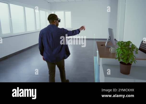 VFX animation: Talented African American designer in VR headset uses ...