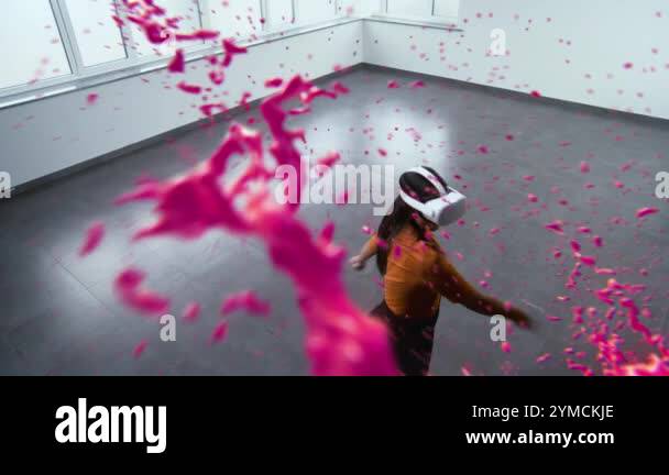 Creative Asian female artist in AR headset paints with wireless ...