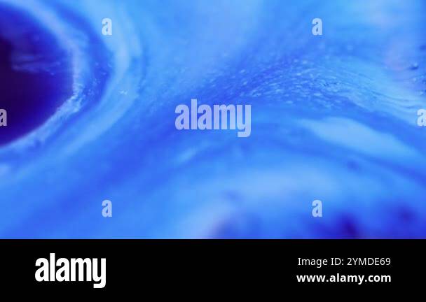 Ink drip. Liquid spill. Defocused blue color glowing acrylic emulsion ...