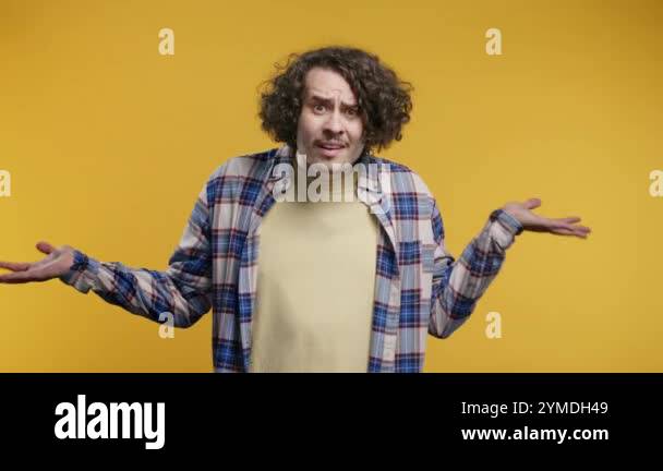 Confused casual 30s aged man, shoulders up - cant help, makes gesture ...