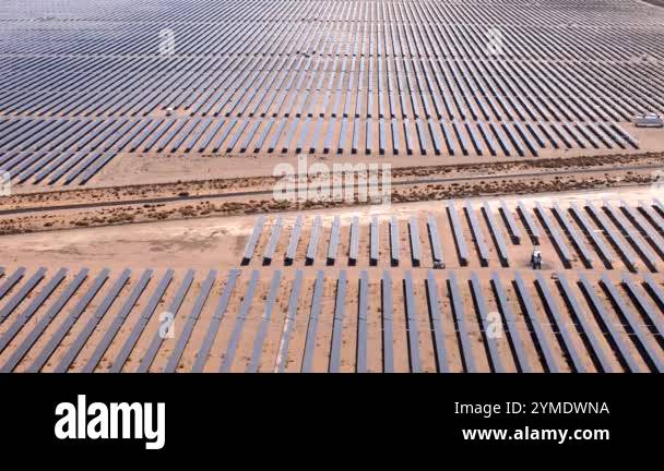 Massive and impressive photovoltaic solar panel field filmed by drone ...