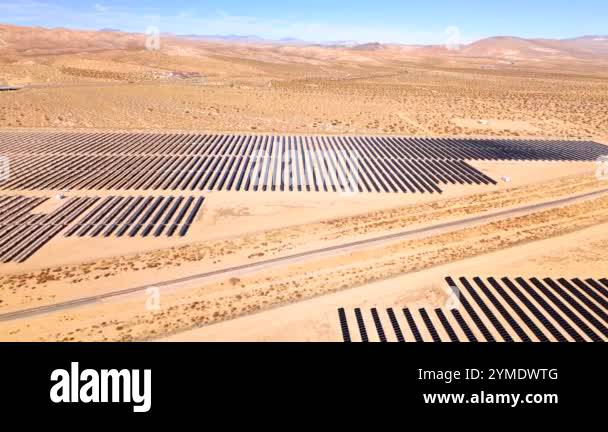 In the expansive Nevada desert, a vast array of photovoltaic solar ...