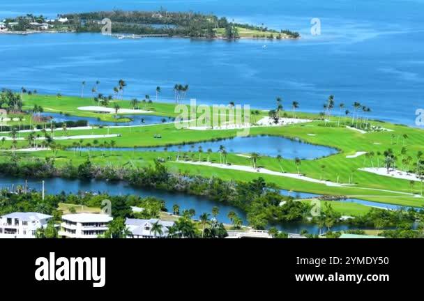 Big golf course field with green grass in Boca Grande, small town on ...