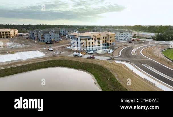 Wooden apartment buildings under construction in new developing ...