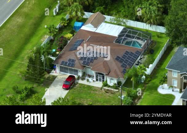 Residential house in USA with rooftop covered with solar photovoltaic ...