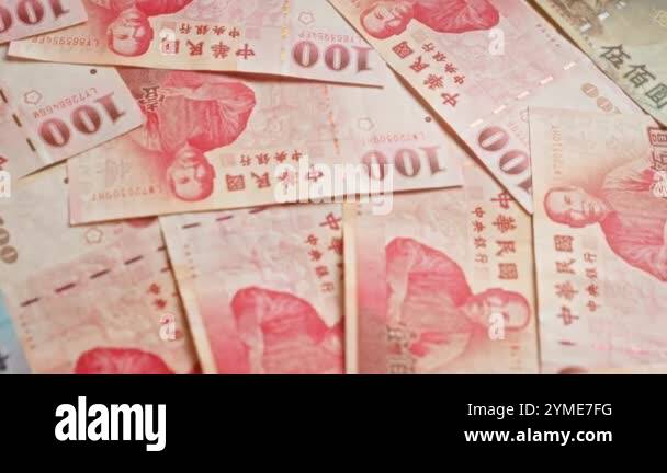 Chinese yuan banknotes scattered in various denominations highlighting ...