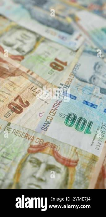 Peruvian banknotes spread out displaying various denominations and ...