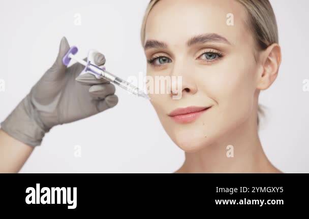 young girl posing in studio, injection concept, cosmetology and skin ...