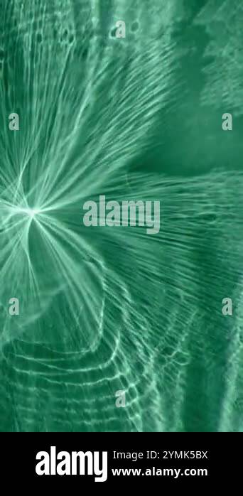 A mesmerizing flow of vibrant green light waves undulates through a ...