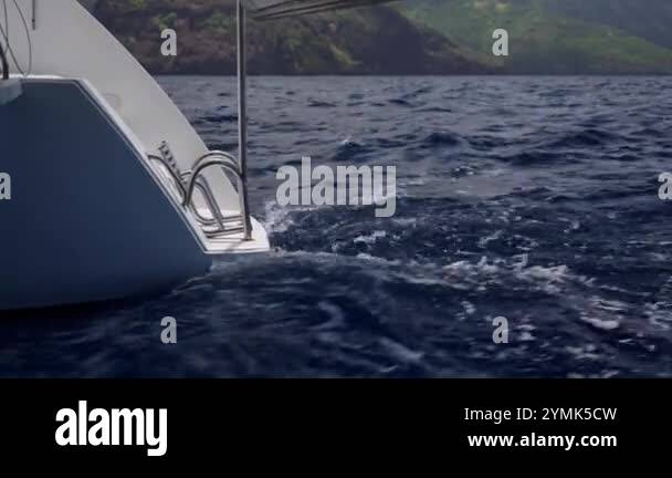 A view from a boat showcases its sleek rear section with a metallic ...