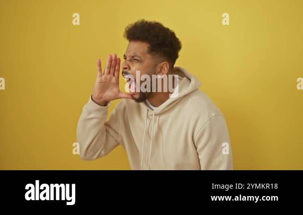 Furious african american guy in a hoodie, yelling a loud message. pure ...