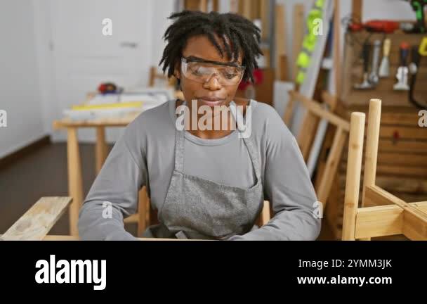 Excited young black woman with dreadlocks celebrates victory in ...