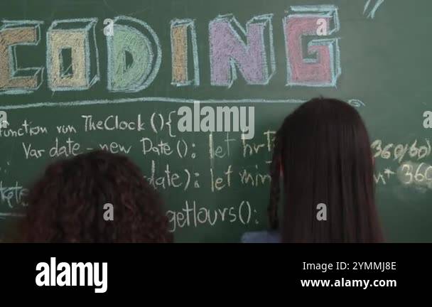 Back view of diverse student writing prompt at board while girl turn ...