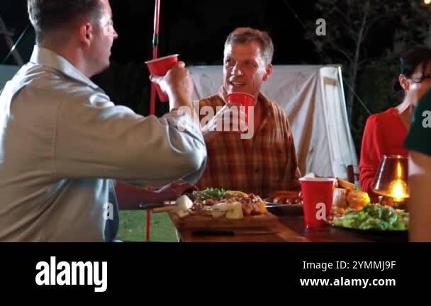 Family gather celebrate holiday. Parents and grandparents together talk ...