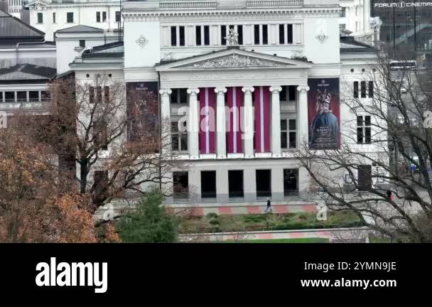 The neoclassical facade of the Latvian National Opera features tall ...
