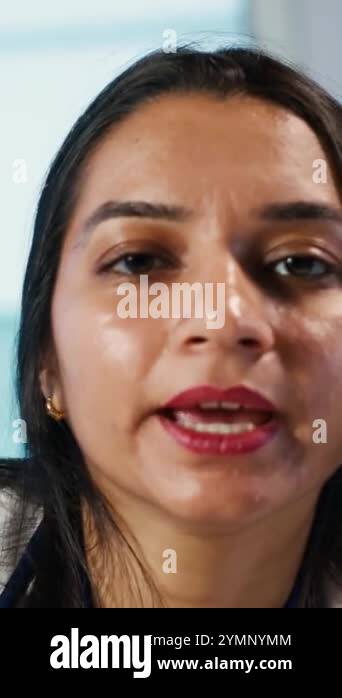 Vertical Video Optometrist expert conducts eye exam for indian male ...