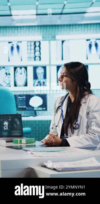 Vertical Video Specialist and patient discussing diagnostic results in a modern medical office ...