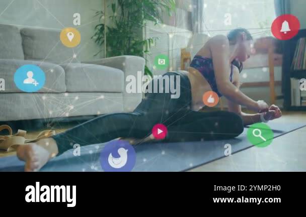 Practicing yoga indoors, woman with social media icons animation ...