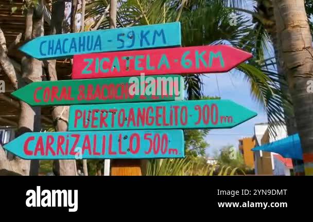 Colorful direction signs arrows to beaches and places in Zicatela ...