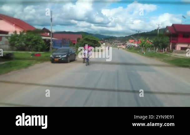 Driving through the mountain farmland and village landscape dusty and ...