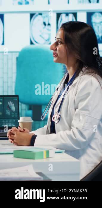 Vertical Video Indian healthcare staff sharing medical expertise with a ...