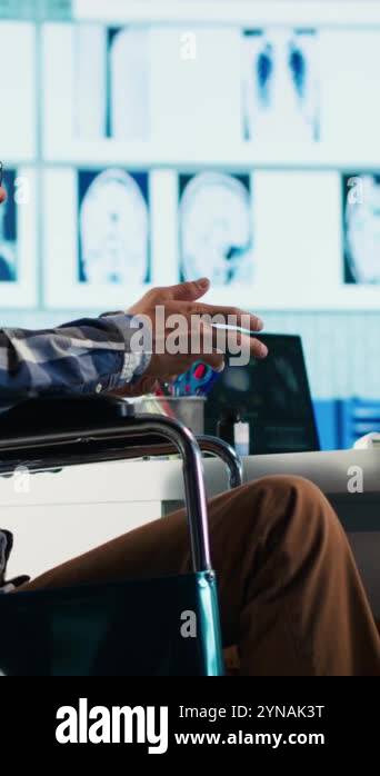 Vertical Video Indian male patient with chronic disability discussing ...