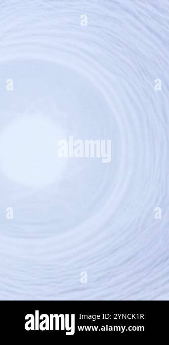 Watch as vibrant alcohol inks blend together, forming beautiful abstract patterns in a calm ...