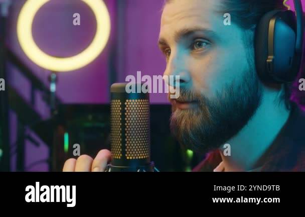 Positive Caucasian man blogger vlogger male in headphones speaker ...