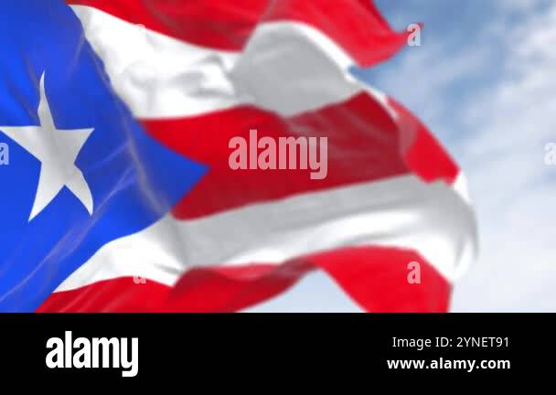 Close-up of Puerto Rico national flag waving in the wind. Puerto Rico ...