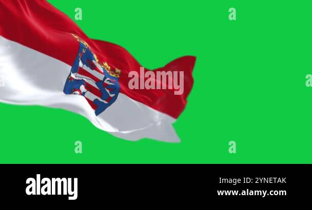 Close-up of the Hesse State flag waving in the wind isolated on green ...