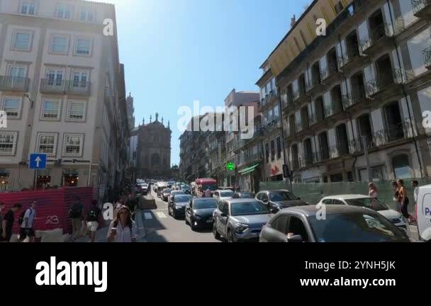 slow-moving traffic in a busy tourist street, with cars filling the ...