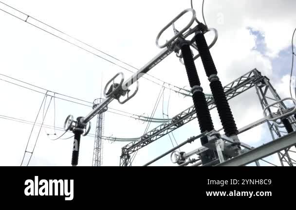 High voltage electrical substation. Power plant with high poles and ...