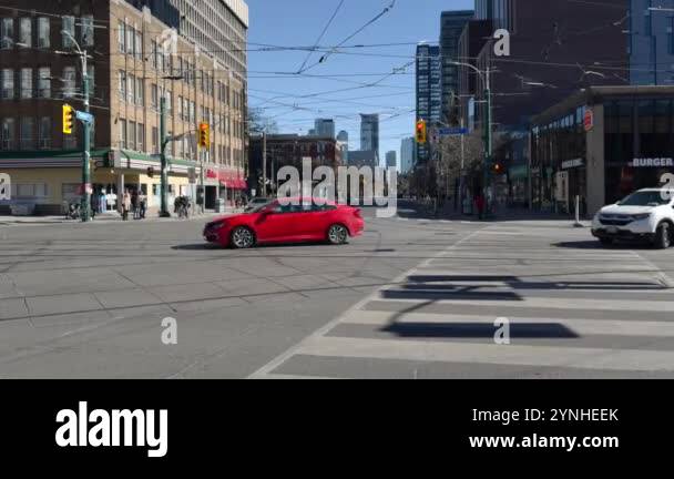 A 4K shot of a street in downtown Toronto on a sunny winter day ...