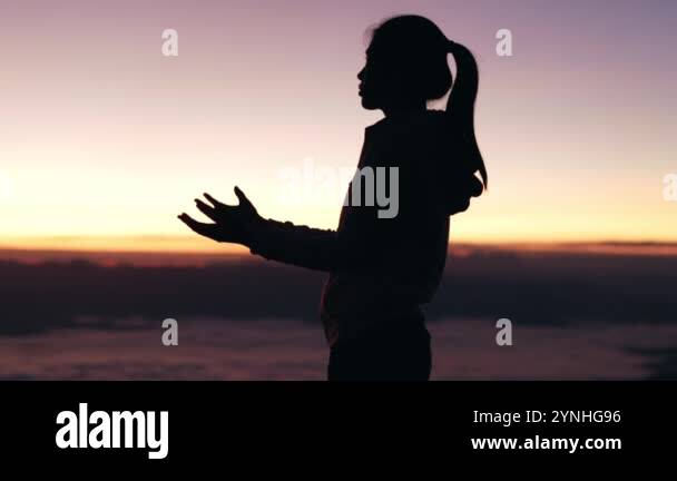 Silhouette of Person hands open palm up worship God helping repent ...