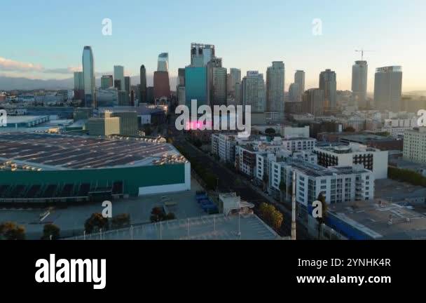 Enjoy a stunning sunrise view of the downtown skyline, with vibrant ...