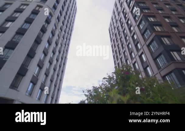 Commercial buildings with mirrored windows stand opposite in downtown ...