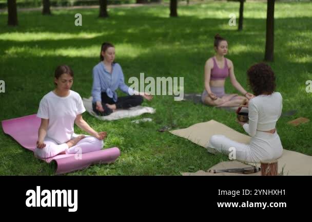 Female yoga instructor guides Stock Videos & Footage - HD and 4K Video ...