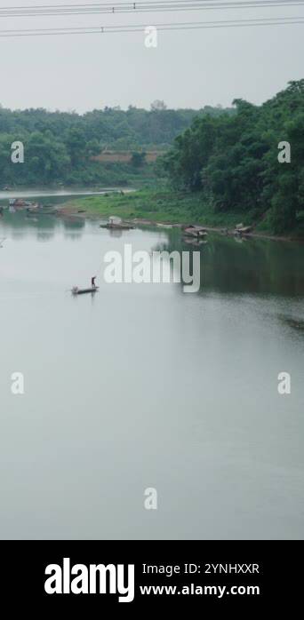 Fishing boats parked on the bank of the big river in the valley ...