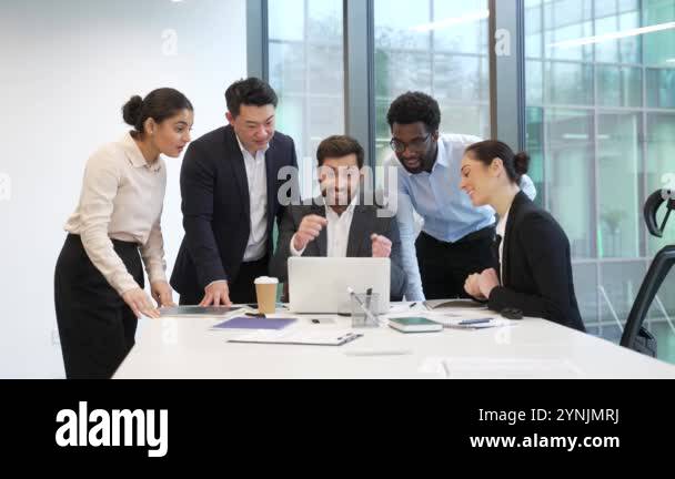Team business people celebrate success and achievement look at laptop ...