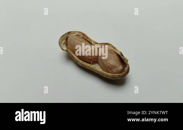 Boiled peanuts that have been peeled from the skin on a white ...