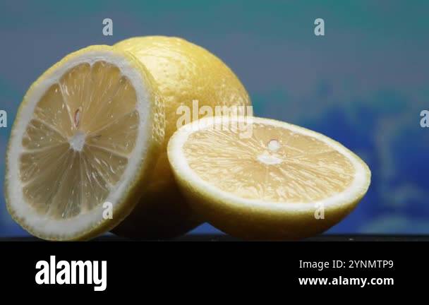 A slice of fresh lemon, bright yellow and vibrantly citric, lies ...