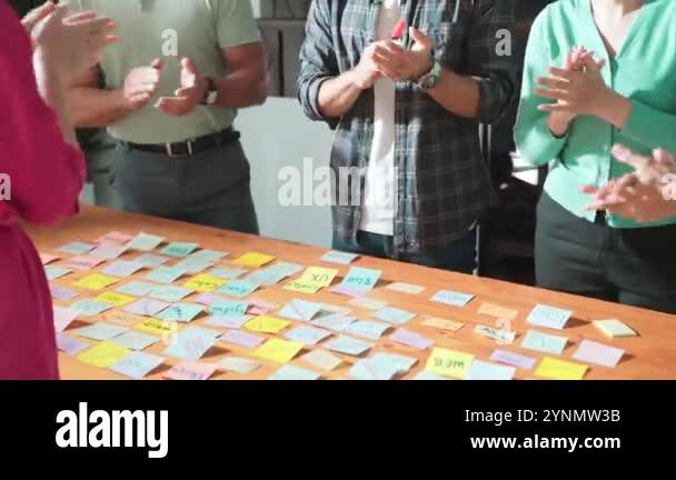 Close up of smart team clap hand to celebrate successful brainstorming ...